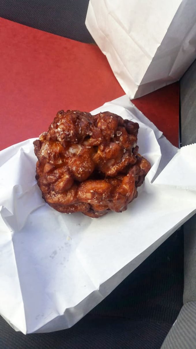 This apple fritter isn't just a donut, it's a commitment—a gloriously caramelized labyrinth of apple-cinnamon pockets worthy of a marriage proposal.