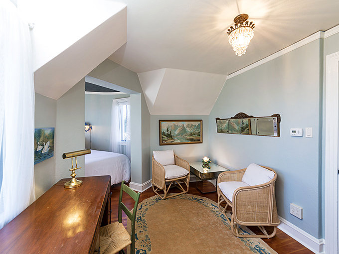 A serene blue retreat where rattan meets relaxation. The kind of room that whispers, "Put down your phone and pick up that book."