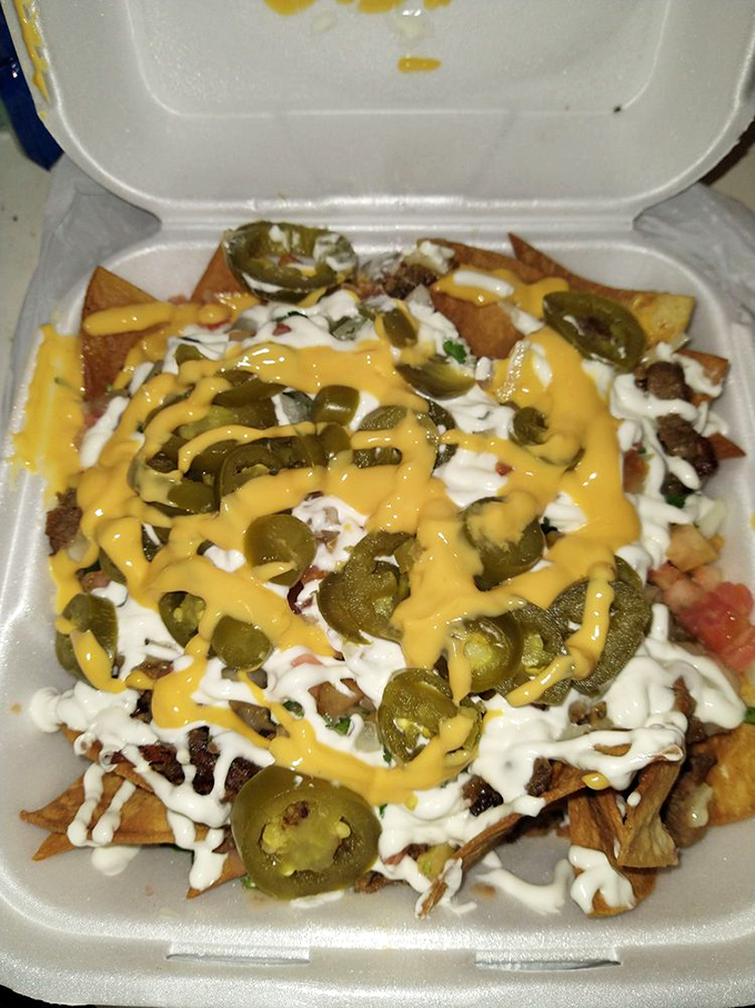 Loaded nachos that laugh in the face of dainty portions. The cheese-to-jalapeño distribution would make Marie Kondo proud.