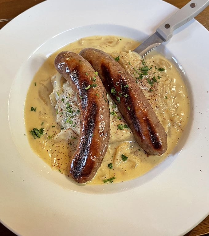 These bangers aren't just singing – they're performing a full symphony atop creamy mashed potatoes in a pool of savory gravy.