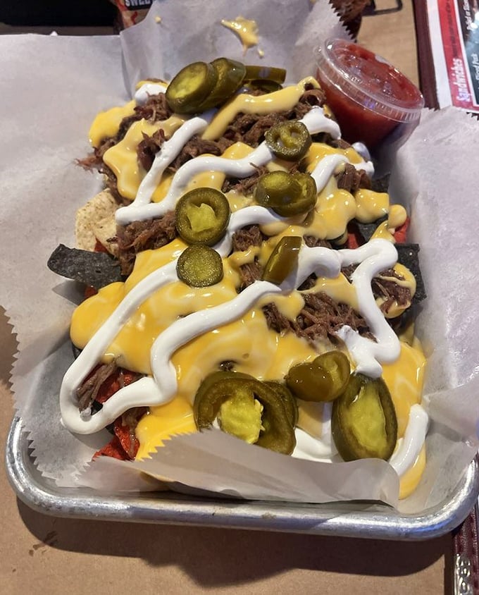 BBQ nachos that redefine the concept of "loaded." These aren't just topped—they're an architectural achievement of cheese, jalapeños, and perfectly smoked meat.