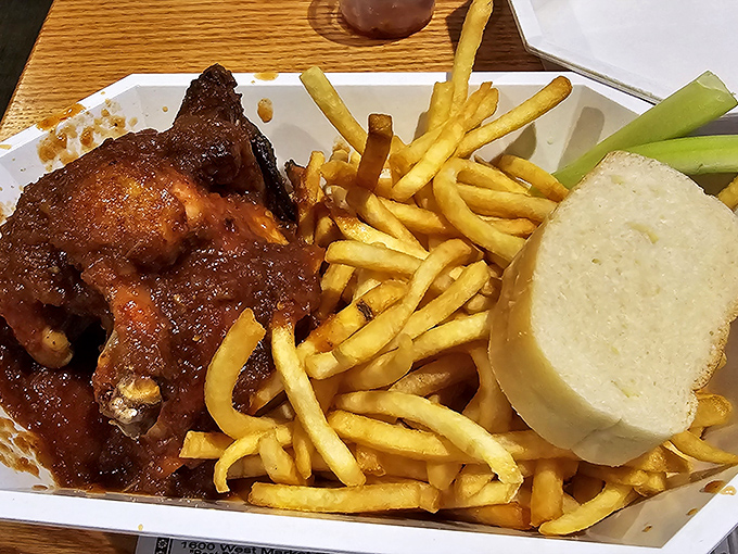 The star of the show—barbecue chicken with skin caramelized to perfection, meat so juicy it should come with a warning label, and bread to soak up every drop.