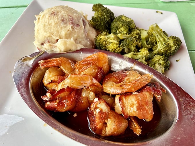 Bacon-wrapped shrimp with mashed potatoes and broccoli—proof that sometimes the simplest combinations create the most profound happiness. Comfort food with a coastal upgrade.