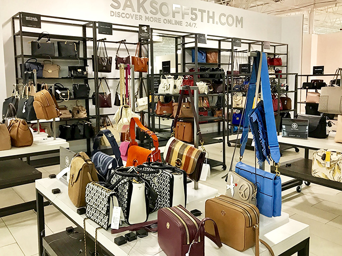 Handbag heaven at Saks OFF 5TH—where wallets go to die happy deaths and shoppers debate whether they need that seventh tote in slightly different beige.