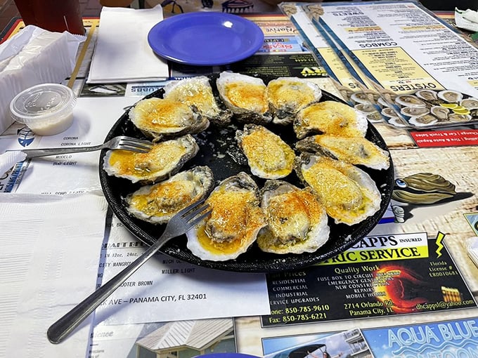 Baked oysters bubbling with cheese and spices on their half-shells—nature's perfect serving dish improved only by fire and butter.