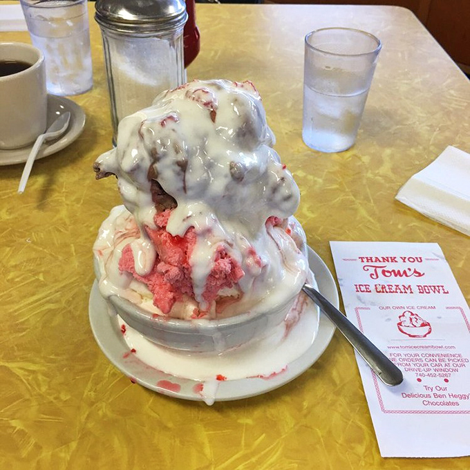 This isn't just a strawberry sundae—it's architecture with a cherry on top. The whipped cream alone deserves its own zip code.