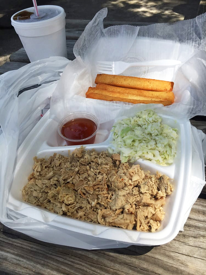 Styrofoam never looked so good. Chopped pork, crisp slaw, and golden cornsticks—a North Carolina postcard you can eat.
