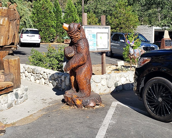 This wooden bear statue isn't just public art – it's Idyllwild's unofficial greeter, standing tall with the confidence of someone who owns the forest.
