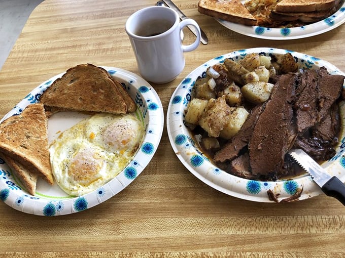 Breakfast of champions: eggs sunny-side up, toast for sopping, and brisket that's been smoking longer than some folks have been driving. Pure morning bliss.
