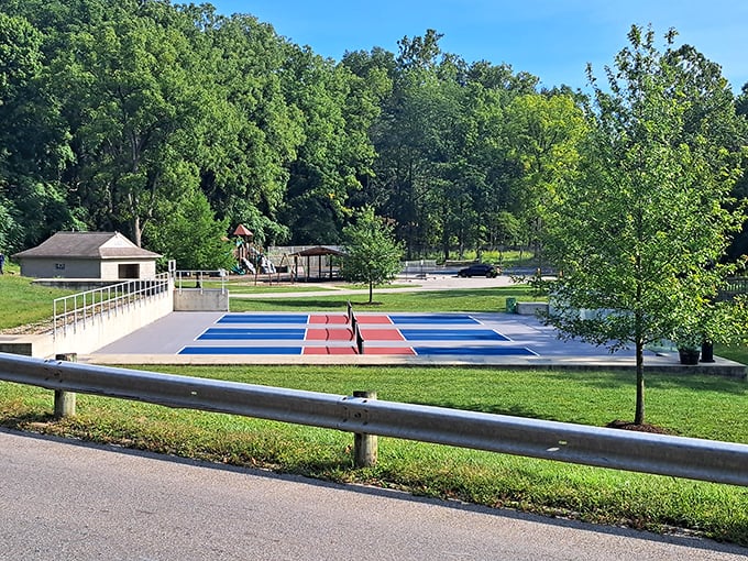 Primary colors pop against summer green at Bicentennial Jaycee Park. This playground proves you're never too old to appreciate a good slide design.