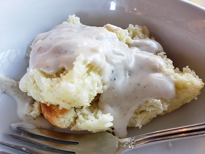 Biscuits drowning in creamy pepper gravy—the kind of breakfast that demands you clear your schedule for a mid-morning nap.