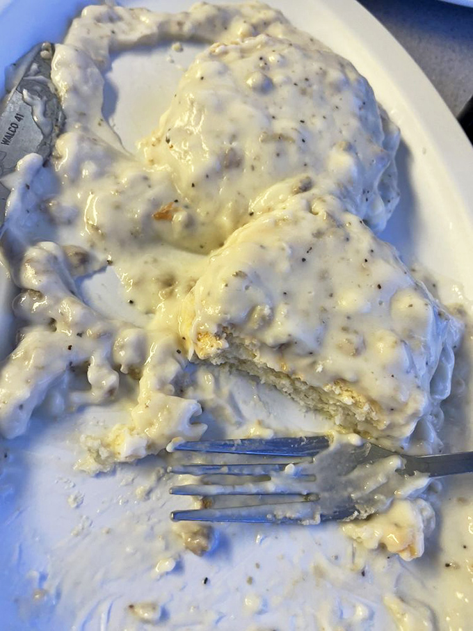 Biscuits buried under an avalanche of peppery sausage gravy—comfort food so sincere it could make a grown adult weep with nostalgia.