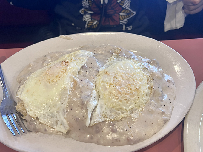 Biscuits and gravy so legendary they deserve their own Ohio historical marker – those eggs aren't floating, they're crowning the masterpiece.