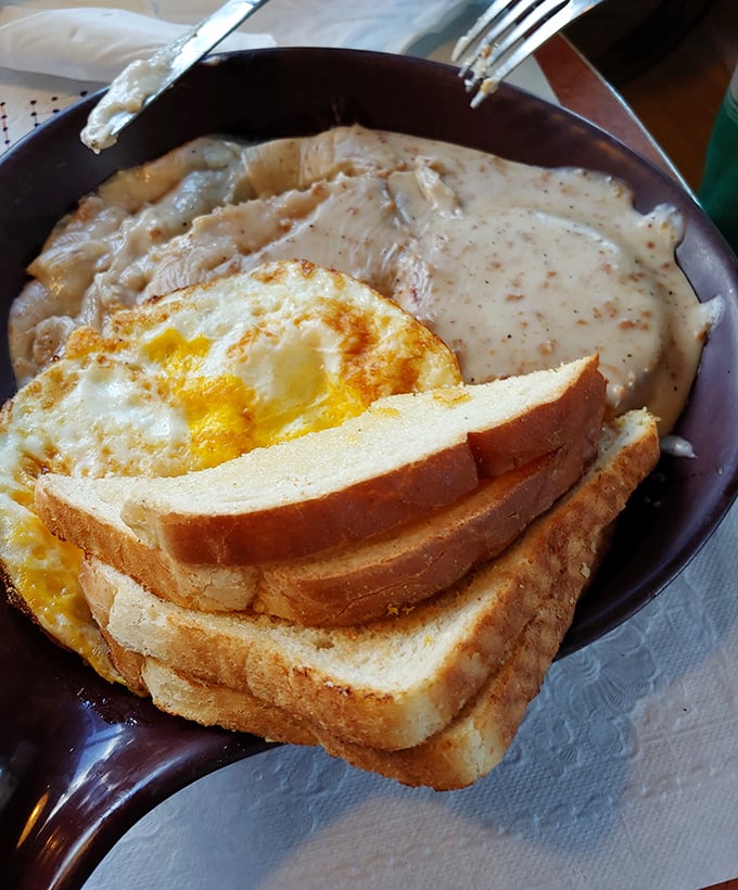 Biscuits swimming in creamy sausage gravy with a sunny-side egg – Southern comfort that somehow found its way to Wisconsin and decided to stay.
