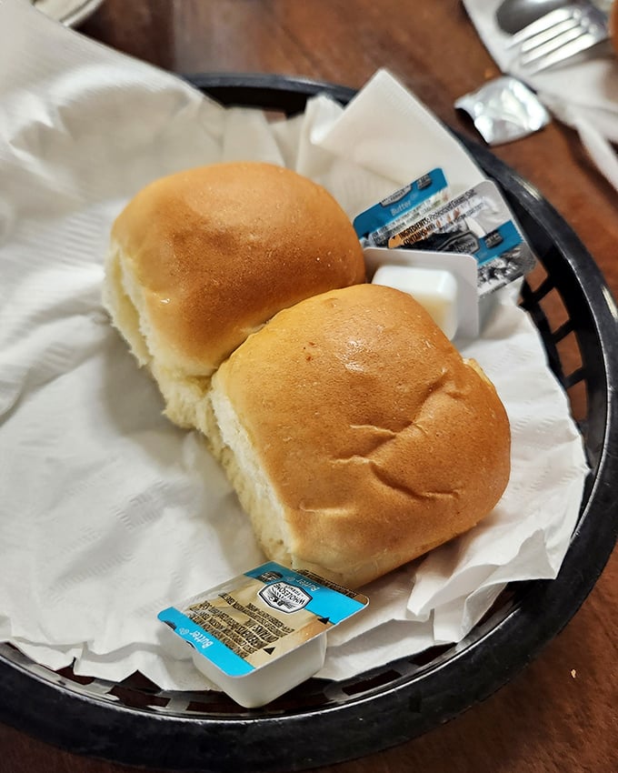These aren't just dinner rolls—they're warm, pillowy preludes to the main event. Simple perfection that needs nothing more than a pat of butter.
