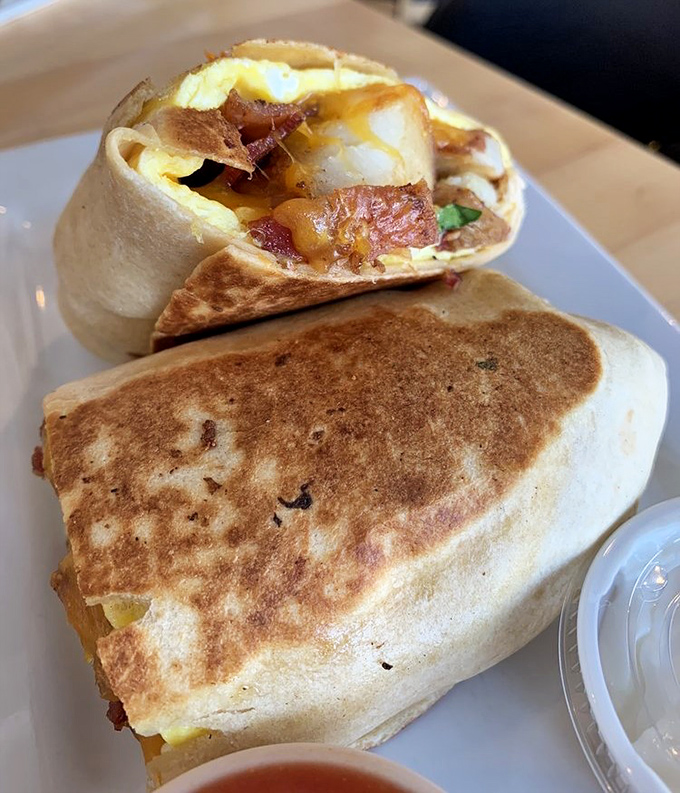 Breakfast's most portable innovation—the burrito that solved the age-old dilemma of how to eat eggs, bacon, and potatoes while driving. Spoiler: you'll want to park.