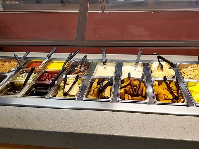 The breakfast buffet lineup—where decisions become impossible and "I'll just have a little of everything" becomes your battle cry. That fried chicken isn't messing around.