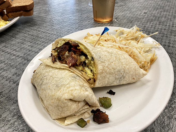 This breakfast burrito wraps up morning perfection in a tortilla, creating handheld happiness that's impossible to resist completely.