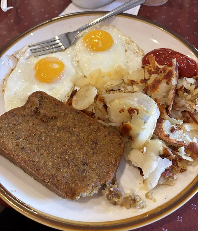 The breakfast trinity—eggs, potatoes, and scrapple—a Pennsylvania morning ritual that fuels both body and nostalgia.