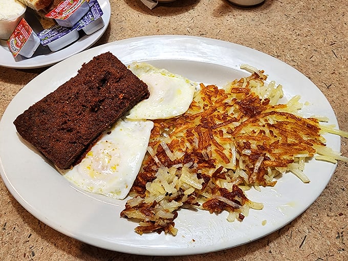 Breakfast perfection doesn't need fancy names—just eggs cooked exactly how you want them, hash browns with the ideal crisp-to-tender ratio, and scrapple for the brave.