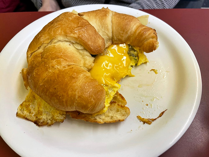 Handheld happiness arrives on your choice of bread, proving that sometimes the best things come in portable packages.