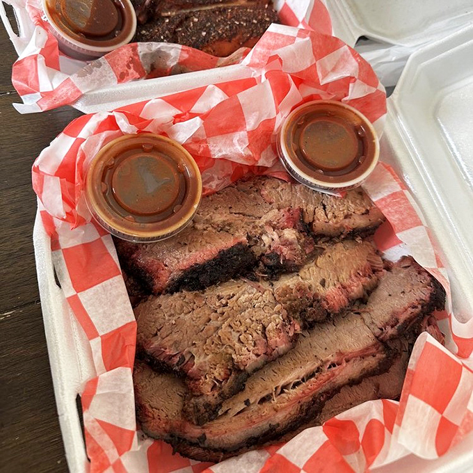 Brisket slices with that telltale pink smoke ring—the barbecue equivalent of Olympic gold. Each slice tells a story of low-and-slow dedication.
