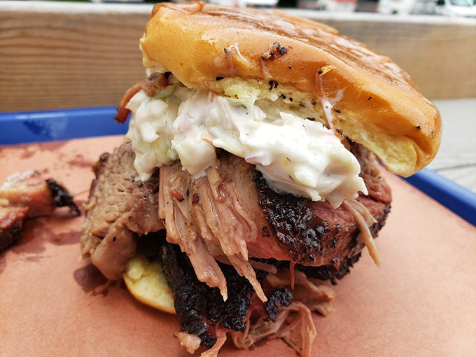 This isn't just a sandwich—it's an architectural marvel of smoke-kissed brisket and creamy slaw engineered for maximum flavor in every magnificent bite.