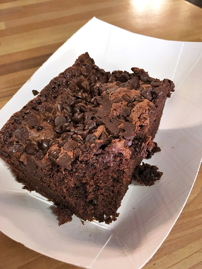 Chocolate chip brownie nirvana. Dense, fudgy, and unapologetically decadent—this isn't dessert, it's therapy you can eat with your hands.