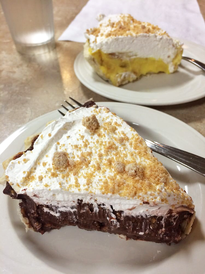 Chocolate cream pie with a mountain of whipped topping – proof that sometimes the best things in life come in triangular form.