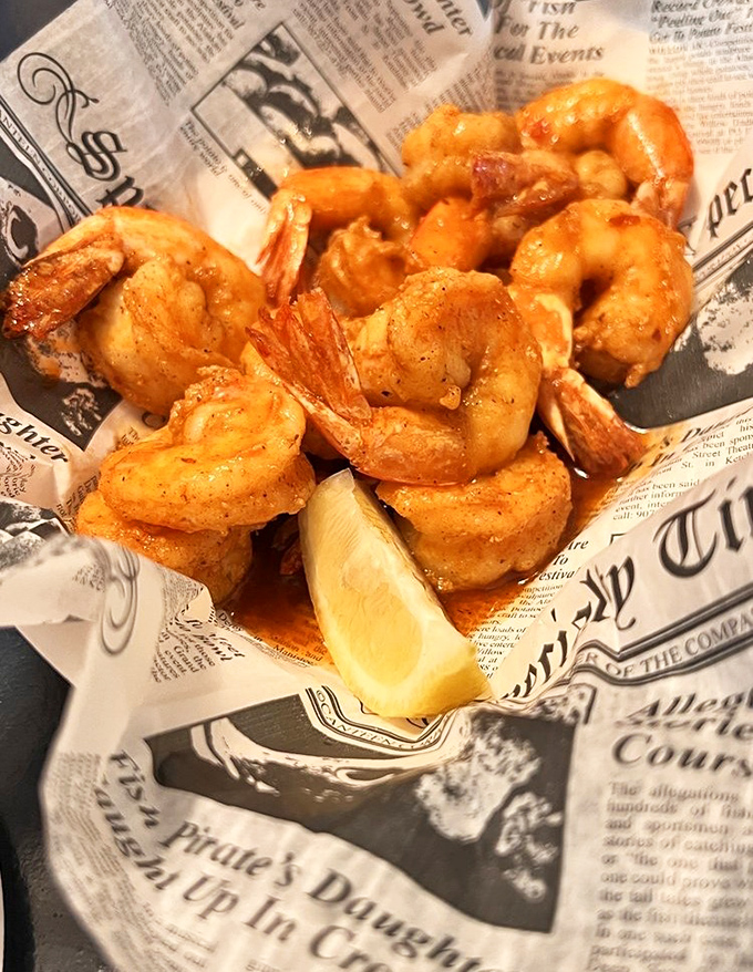 Fried shrimp served on newspaper—because when seafood is this good, fancy plates would just get in the way of the relationship.