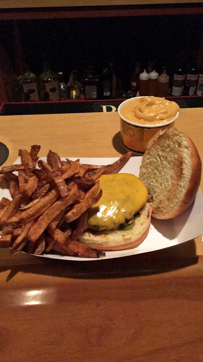 Behold: the perfect burger-to-fry ratio. That cheese blanket isn't just melting—it's surrendering completely to the patty beneath it.