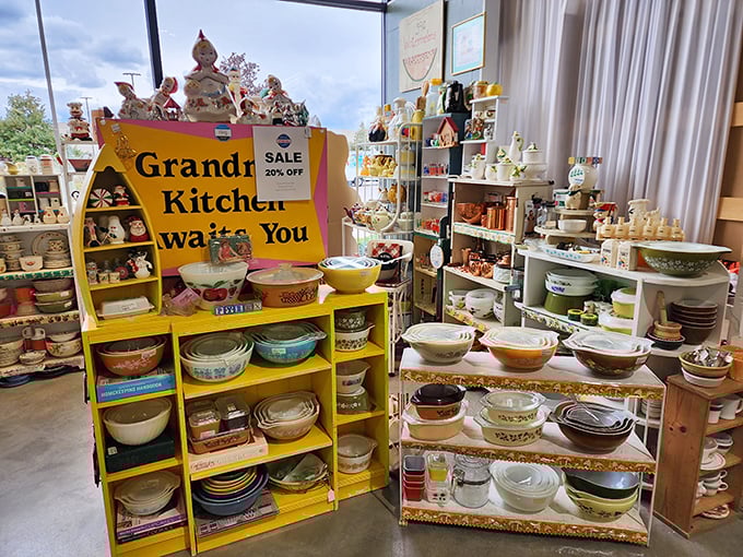"Grandma's Kitchen Awaits You" indeed – a sunshine-yellow display of Pyrex patterns that would make Betty Crocker weep with joy.