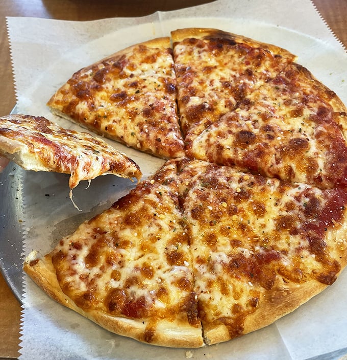 Pizza that doesn't try to reinvent the wheel—just perfectly melted cheese, a crust with character, and the kind of simplicity that never goes out of style.