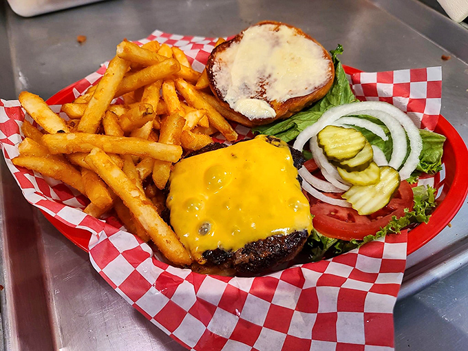 A proper cheeseburger doesn't need a fancy introduction—just melty cheese, fresh toppings, and fries that demand to be devoured.