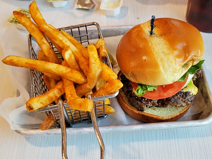 A classic burger and fries served in a wire basket. Sometimes the simplest pleasures are the most satisfying—like finding a parking spot at the mall.
