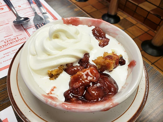 The famous cherry cobbler that launched a thousand road trips. That vanilla ice cream isn't melting—it's swooning in the presence of greatness.