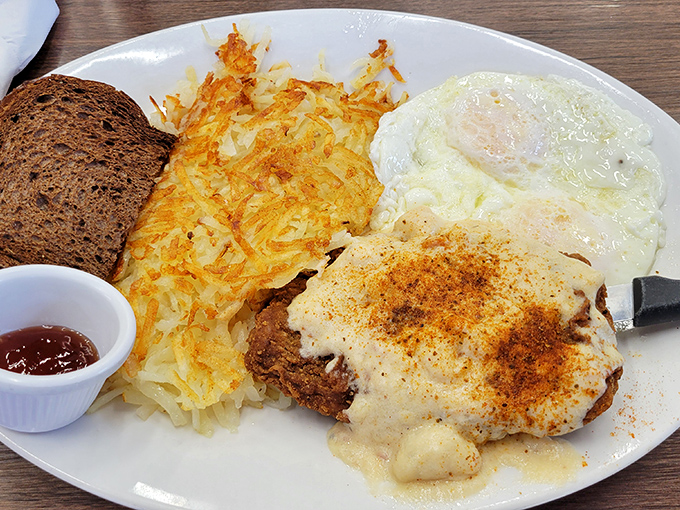 Country-fried steak with gravy: where comfort food meets artistic expression. The crispy edges practically sing a breakfast ballad.