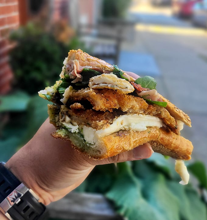 This chicken cutlet sandwich isn't just food—it's edible architecture. Crispy, gooey, and fresh elements creating the Taj Mahal of lunch options.