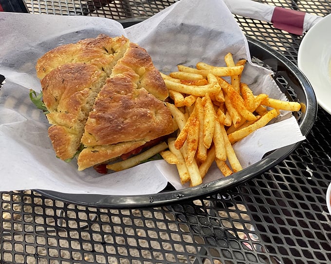 Sandwich architecture at its finest. Golden focaccia embracing whatever deliciousness lies within, with those fries standing at perfect attention.
