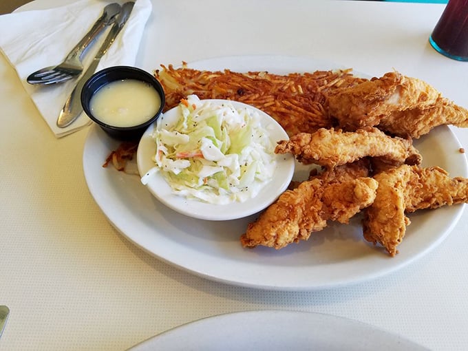Chicken tenders that actually taste like chicken—revolutionary concept! Paired with hash browns that could make a potato farmer weep with pride.