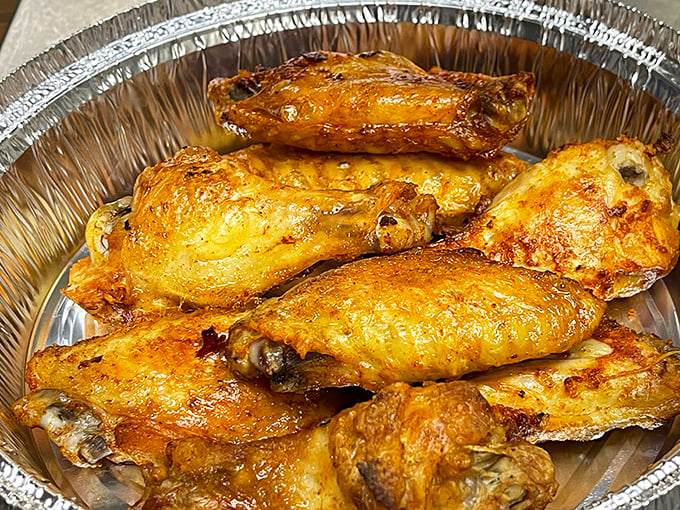 Golden-brown chicken wings that look like they've been sunbathing in deliciousness. Crispy on the outside, juicy on the inside – wing perfection achieved.