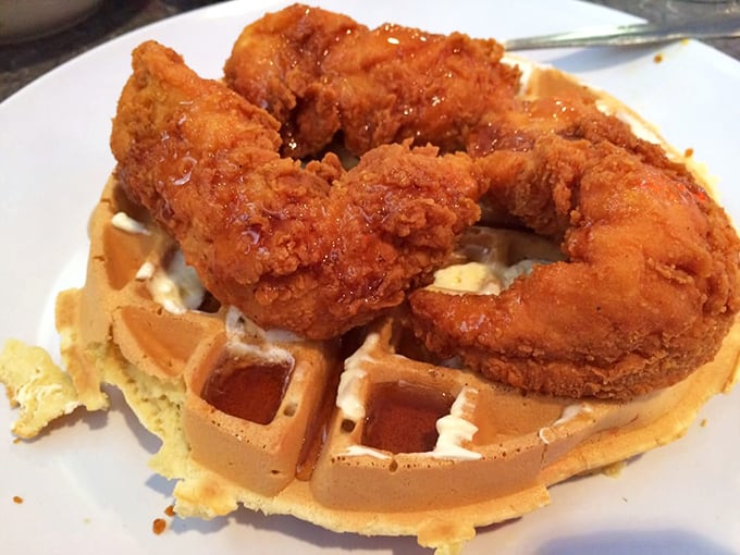 Chicken and waffles: the breakfast-lunch alliance that proves opposites don't just attract—they create culinary magic. That golden-brown chicken skin is speaking to me.