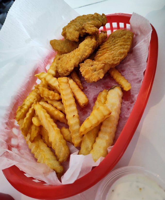 Golden-battered chicken fingers and crinkle-cut fries – proof that some childhood favorites deserve permanent spots in our adult dining repertoire.