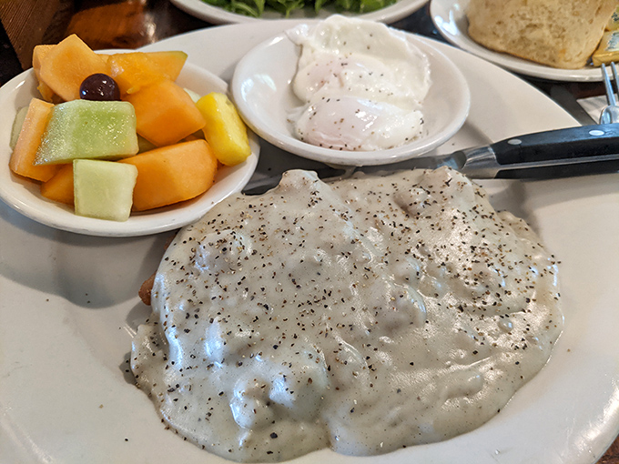 Country gravy blankets this chicken fried steak like a comforting winter quilt. Forget counting calories; this is breakfast that hugs you from the inside.