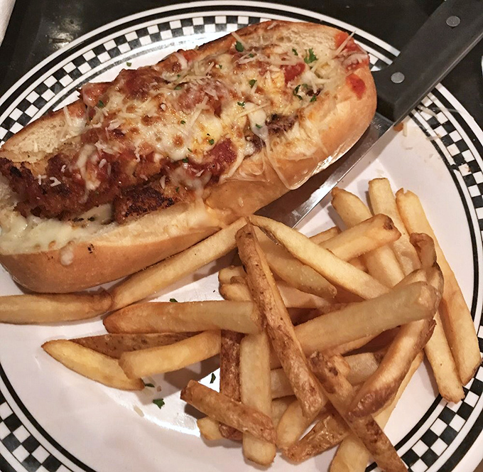 This chicken parm sandwich is what happens when Italian comfort food meets deli craftsmanship. Those fries aren't just a side—they're worthy companions.