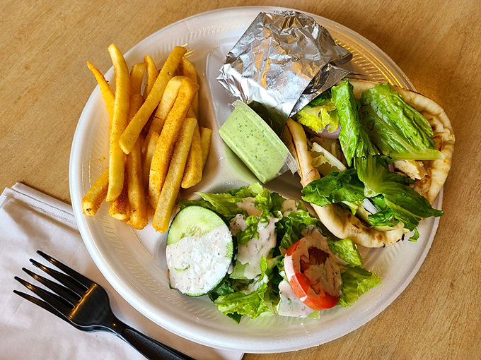 The chicken shawarma combo plate: where perfectly seasoned meat meets fresh vegetables in a relationship more harmonious than most Hollywood marriages.