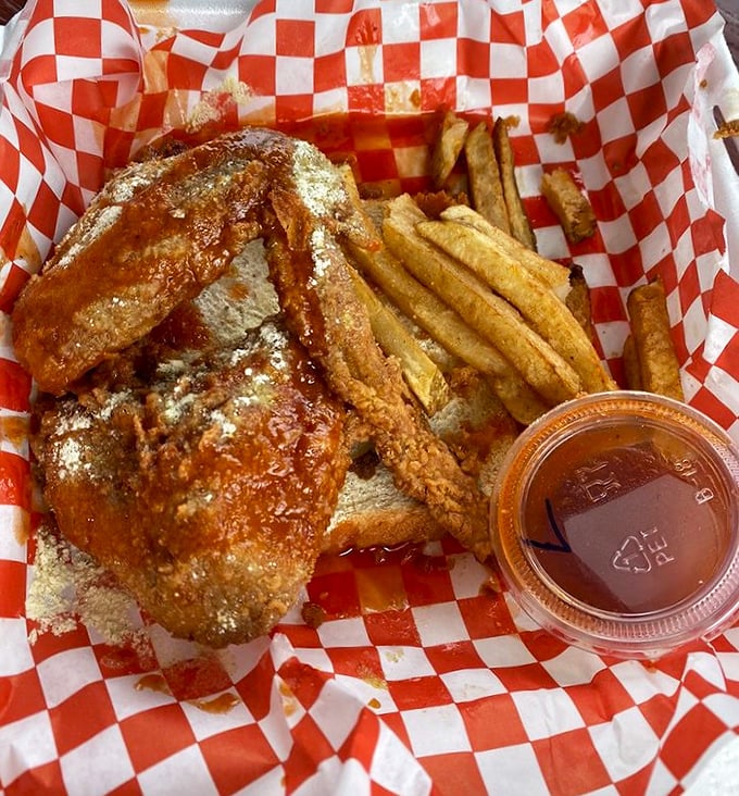 That moment when sauce meets perfectly fried chicken—a marriage so beautiful it deserves its own ceremony and possibly a tear of joy.