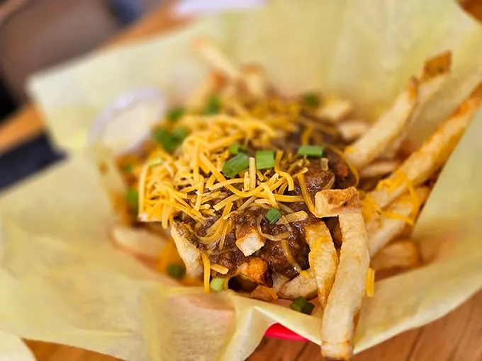 Chili fries that don't apologize for their indulgence—crispy, golden soldiers standing at attention under a blanket of savory goodness.