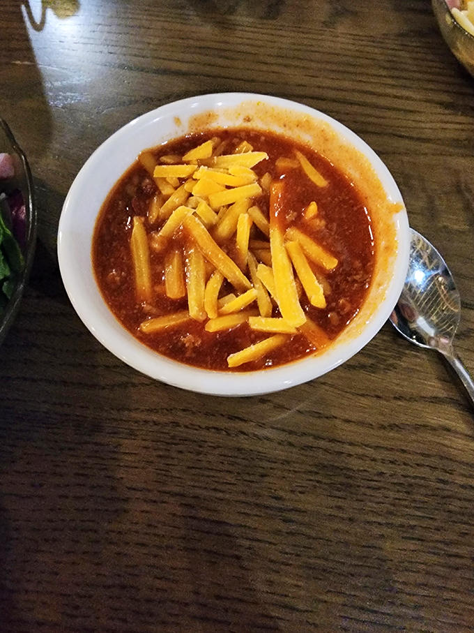 Not just chili, but a hearty declaration of Midwestern values—where cheese isn't a garnish, it's a fundamental right.