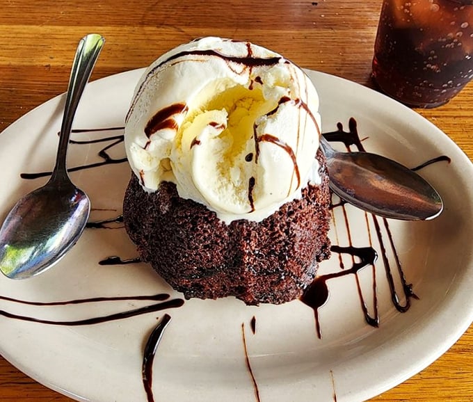 The molten chocolate cake doesn't just satisfy your sweet tooth—it throws a full-blown celebration for it, complete with ice cream and chocolate drizzle.